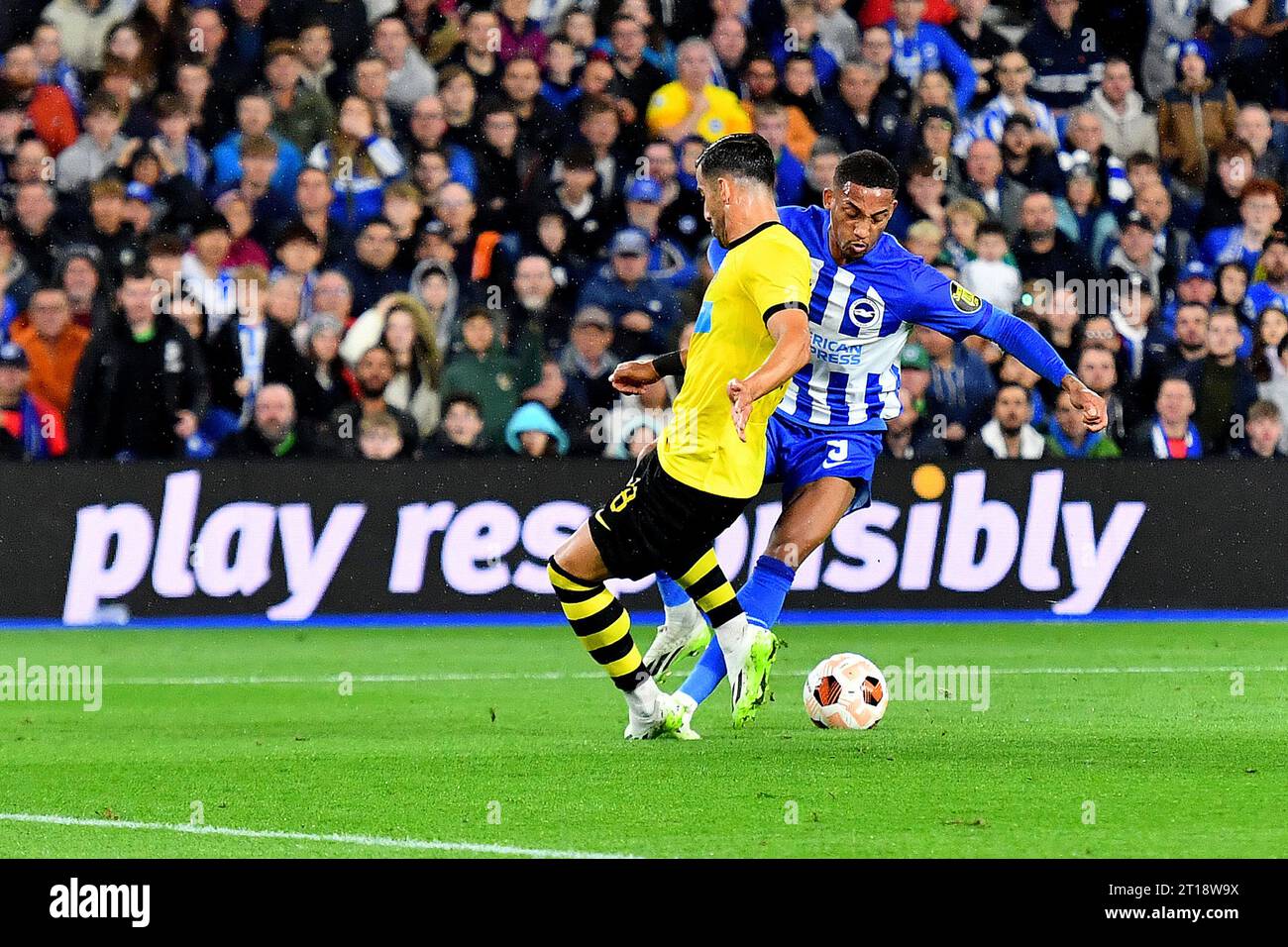 Mijat Gacinovic of AEK Athens and Joao Pedro of Brighton and Hove ...