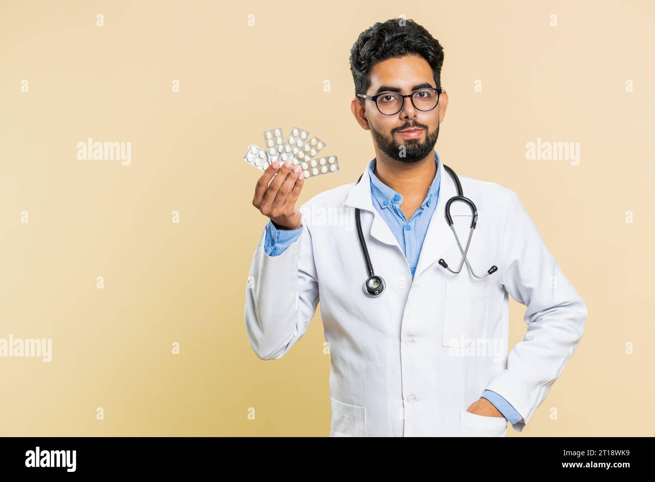 Indian doctor cardiologist man shows lot of tablet pills in blisters ...