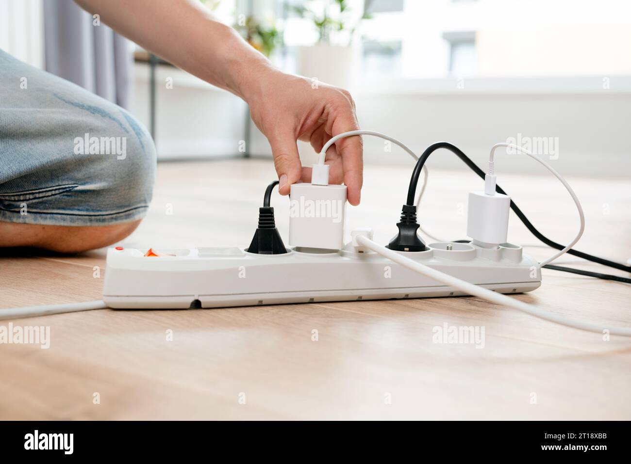 Electrical plug in outlet socket at home. Energy efficiency concept ...