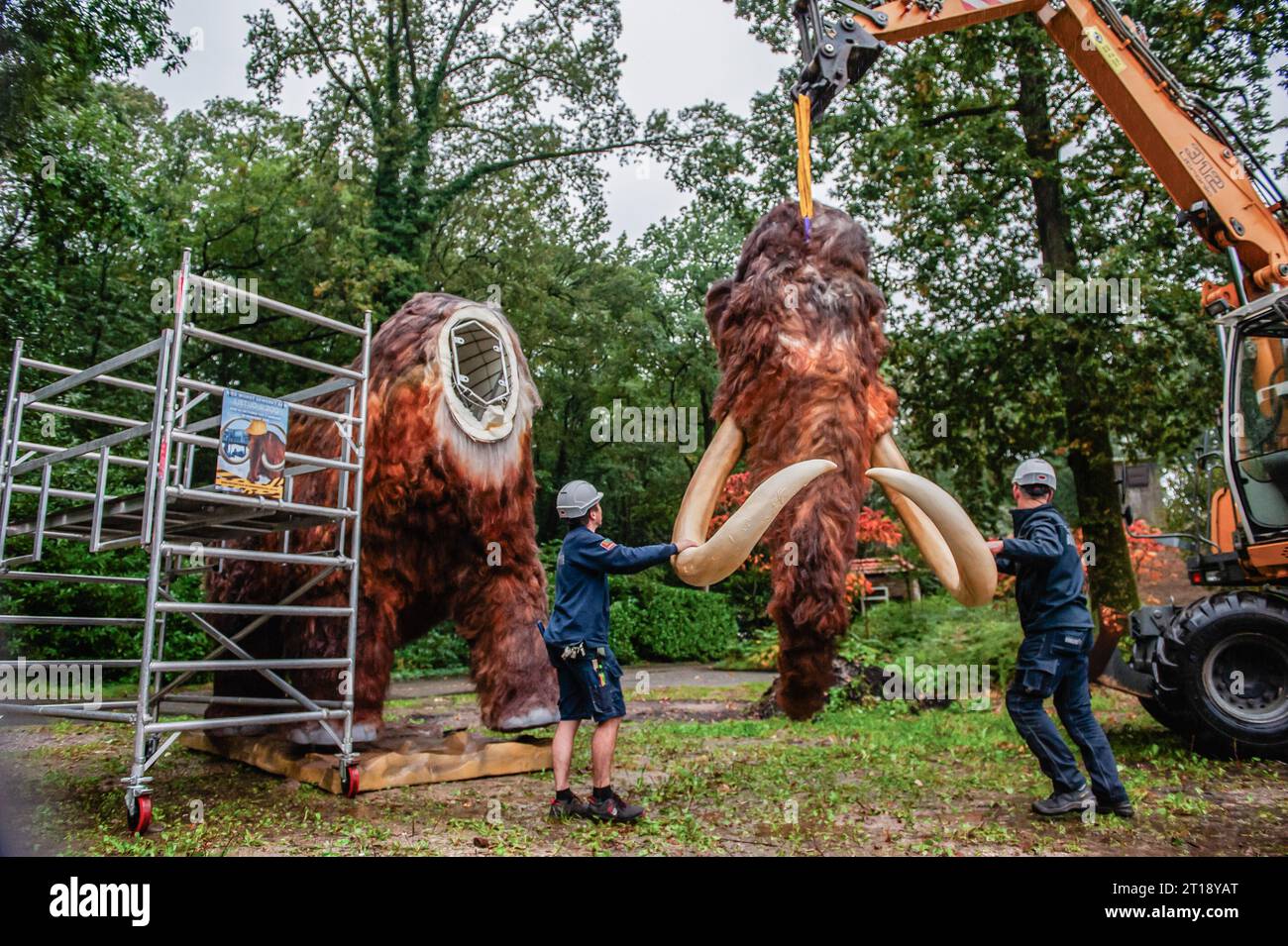 A forklift truck is seen moving closer the head to the body. This ...