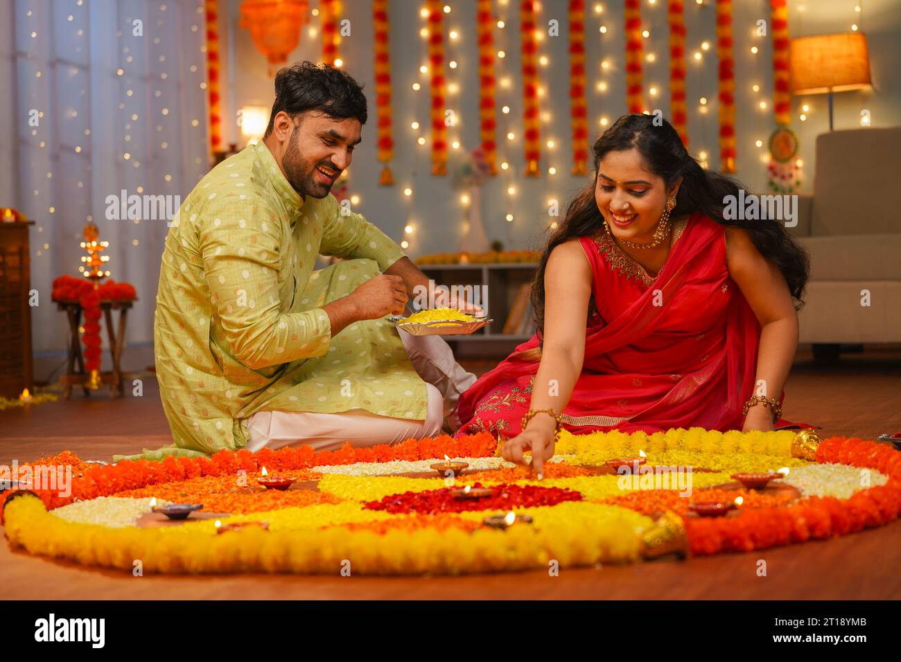 Diwali rangoli family hi-res stock photography and images - Alamy