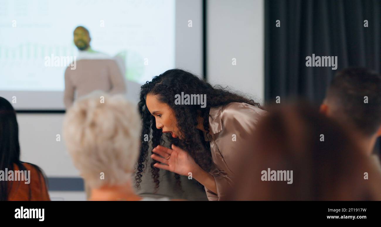 Conference, presentation and woman whisper in audience of training ...