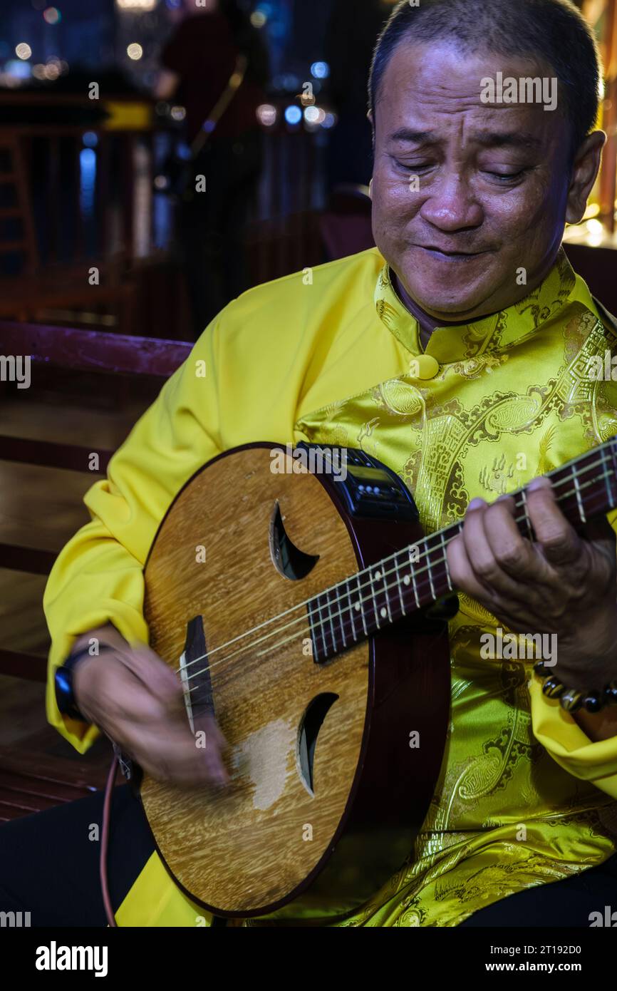 Ho Chi Minh City, Vietnam. Dan Nguyet, Moon Guitar, Played by ...
