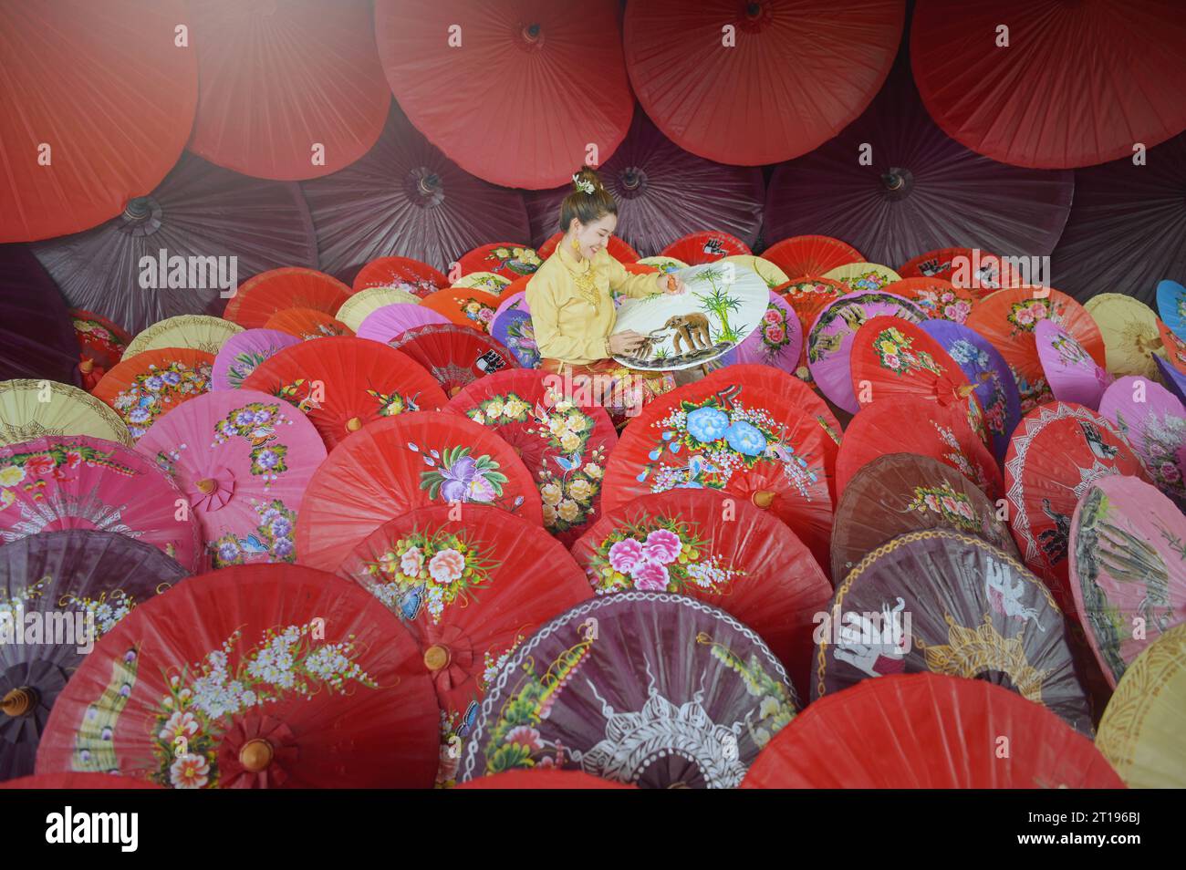 Women painting traditional paper umbrellas, Chiang Mai, Thailand Stock ...