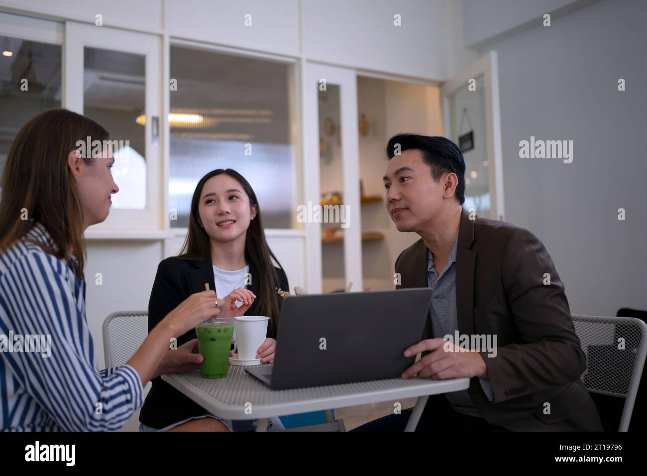 Coworkers hang out at coffee café. Coworker and friendship concept ...