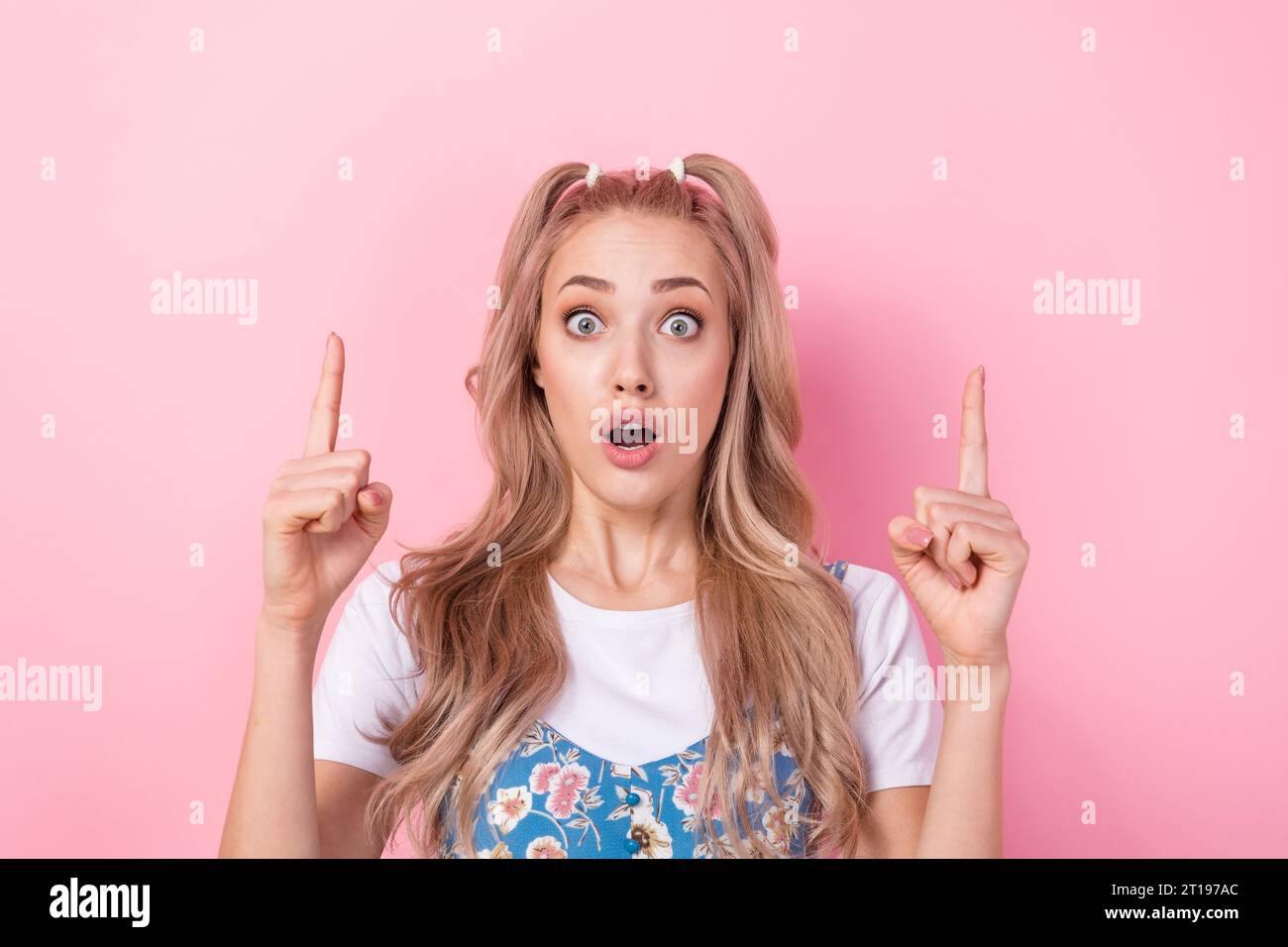 Photo portrait of pretty young girl shocked scared point up empty space ...