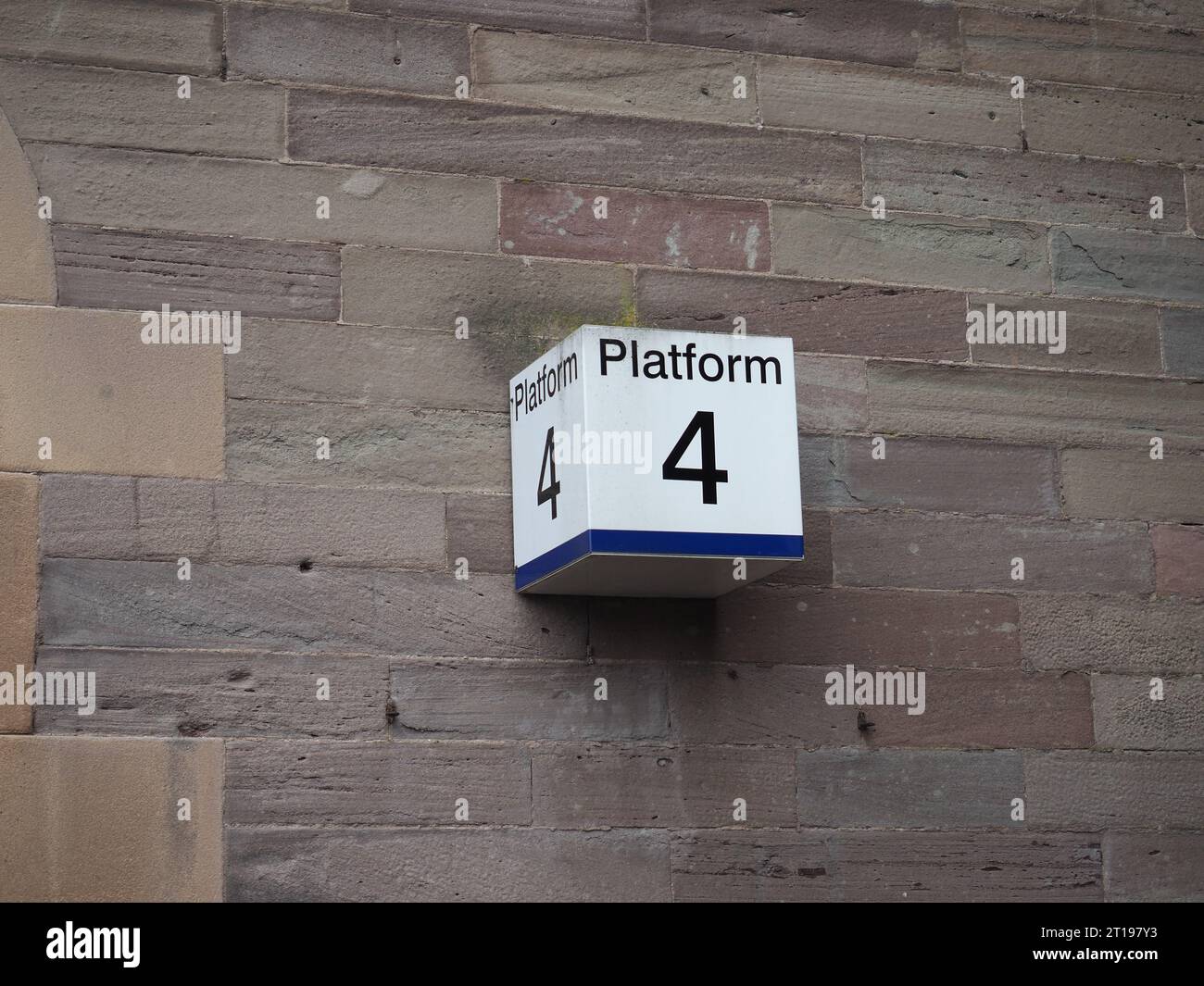 platform 4 sign on railway station wall Stock Photo - Alamy