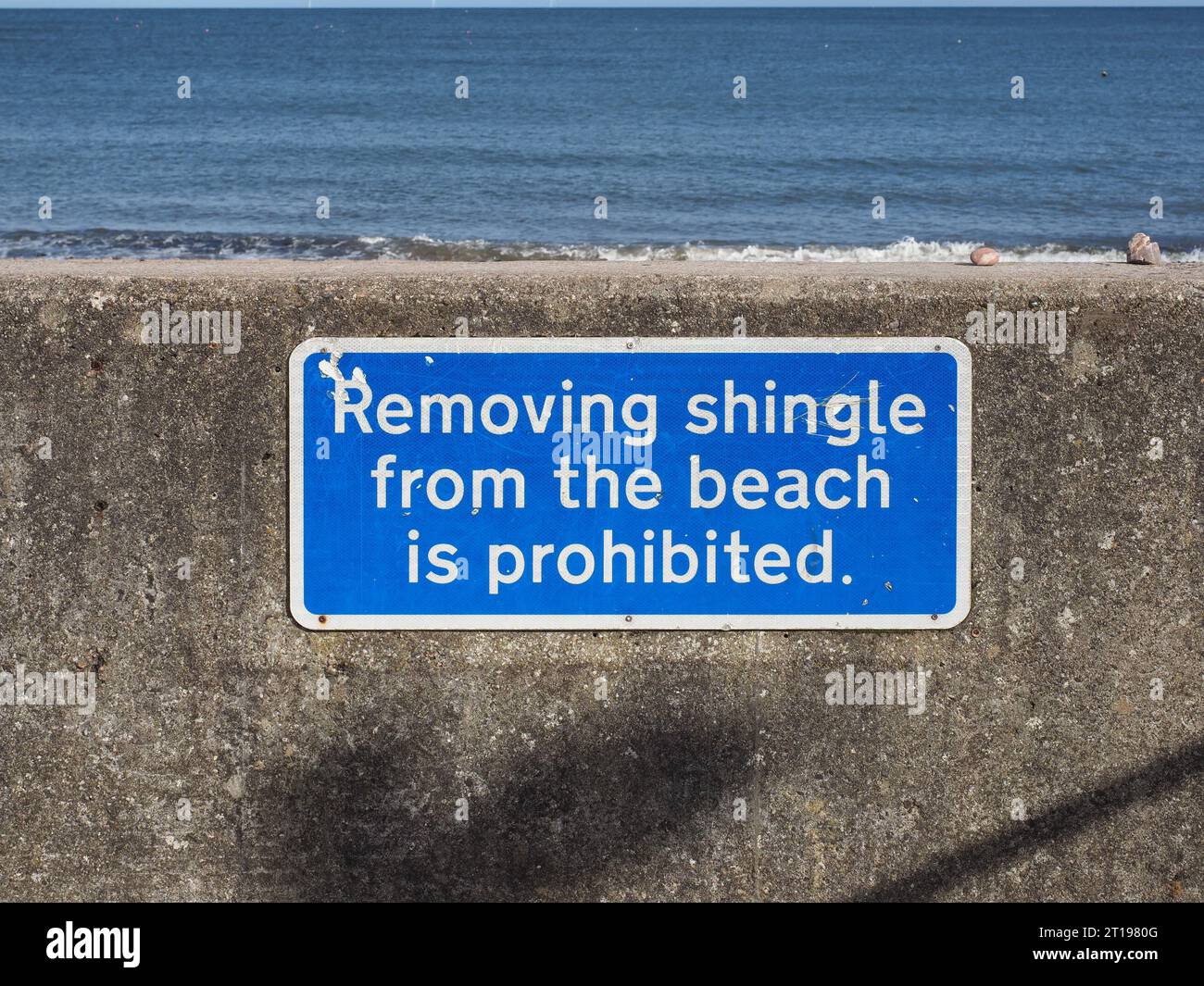 removing shingle from the beach is prohibited sign Stock Photo - Alamy