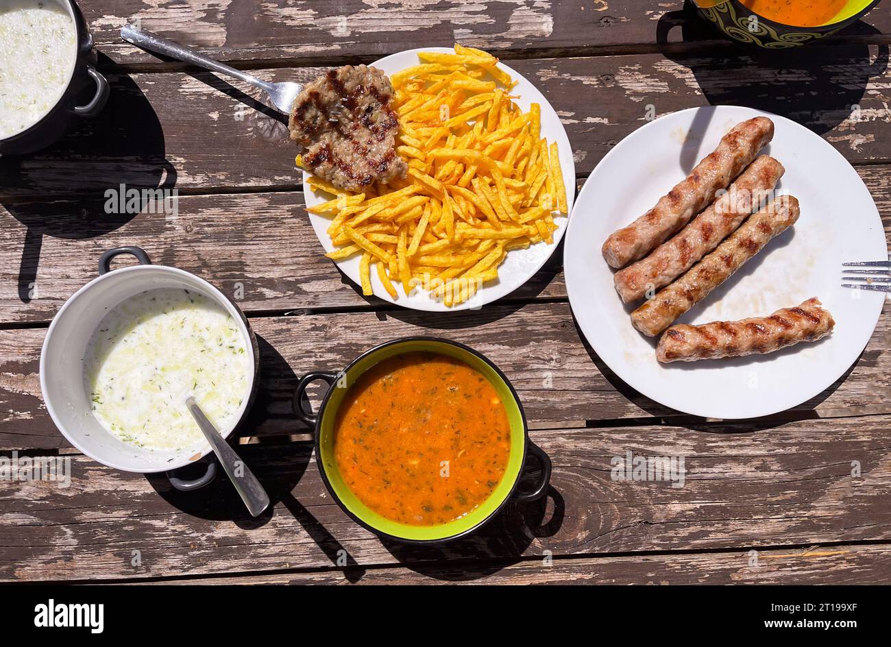 Overhead view of traditional Bulgarian kebapche meatball, bean soup ...