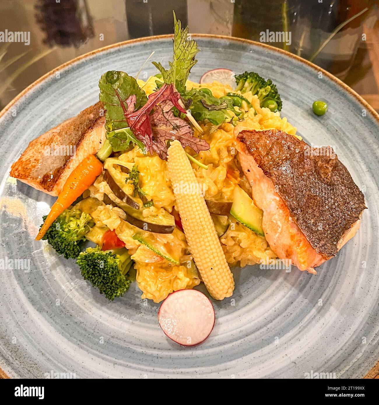 Traditional Peruvian grilled salmon with quinoa risotto and mixed ...