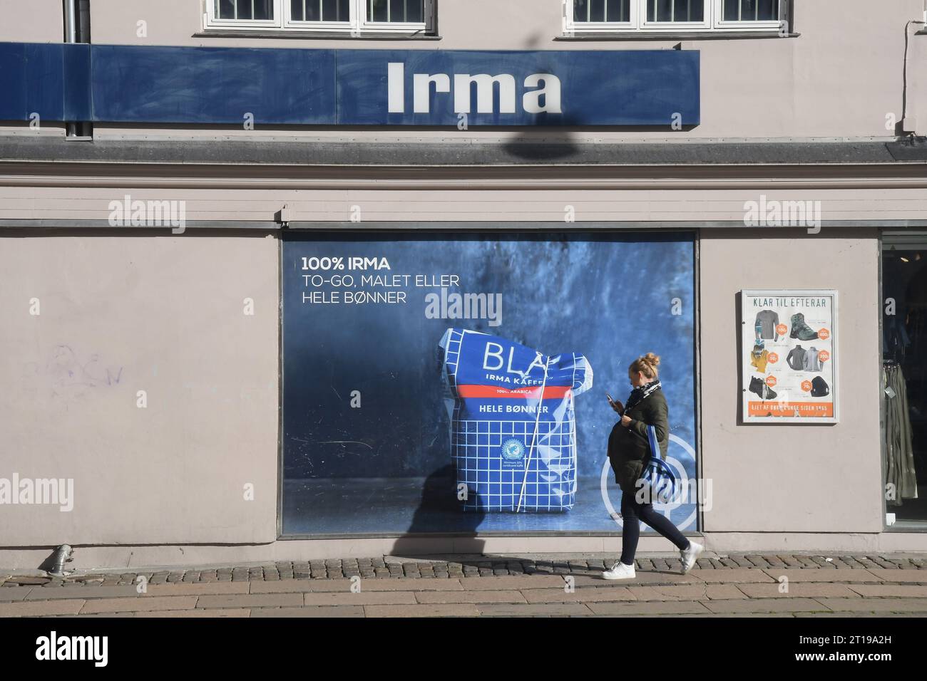 Copenhagen, Denmark /12 October. 2023/.Shopers and people walk b y Irma ...