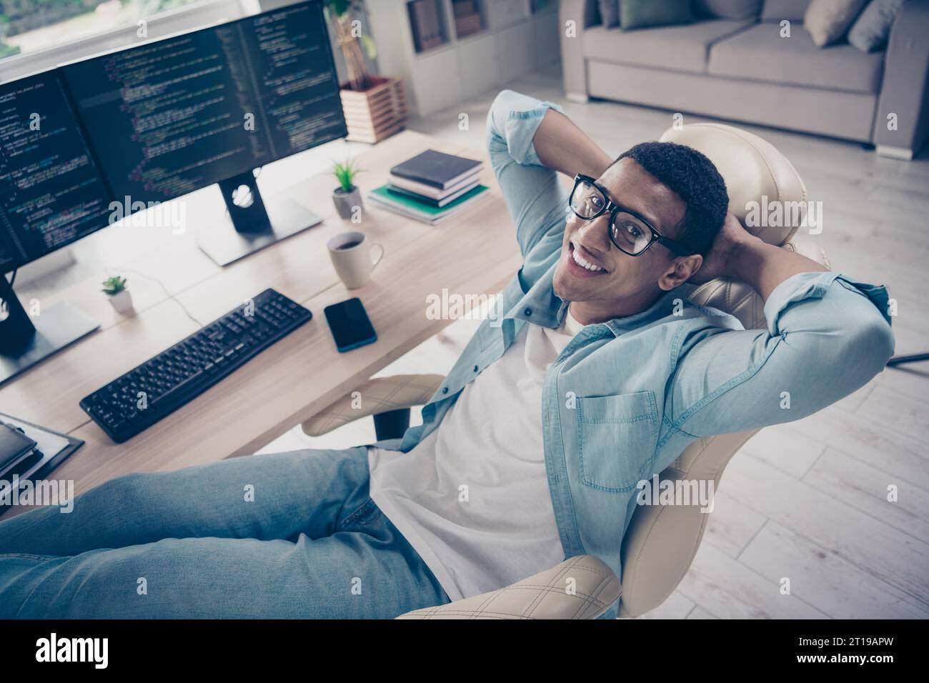 Photo of smiling young positive guy expert back end development website ...