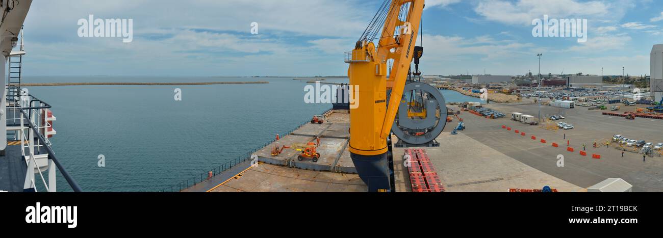 A newly constructed rail car dumper being loaded on to a shipping ferry ...