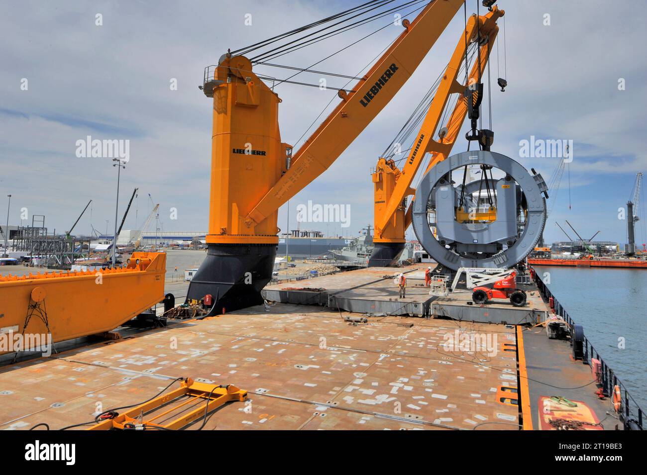 A newly constructed rail car dumper being loaded on to a shipping ferry ...