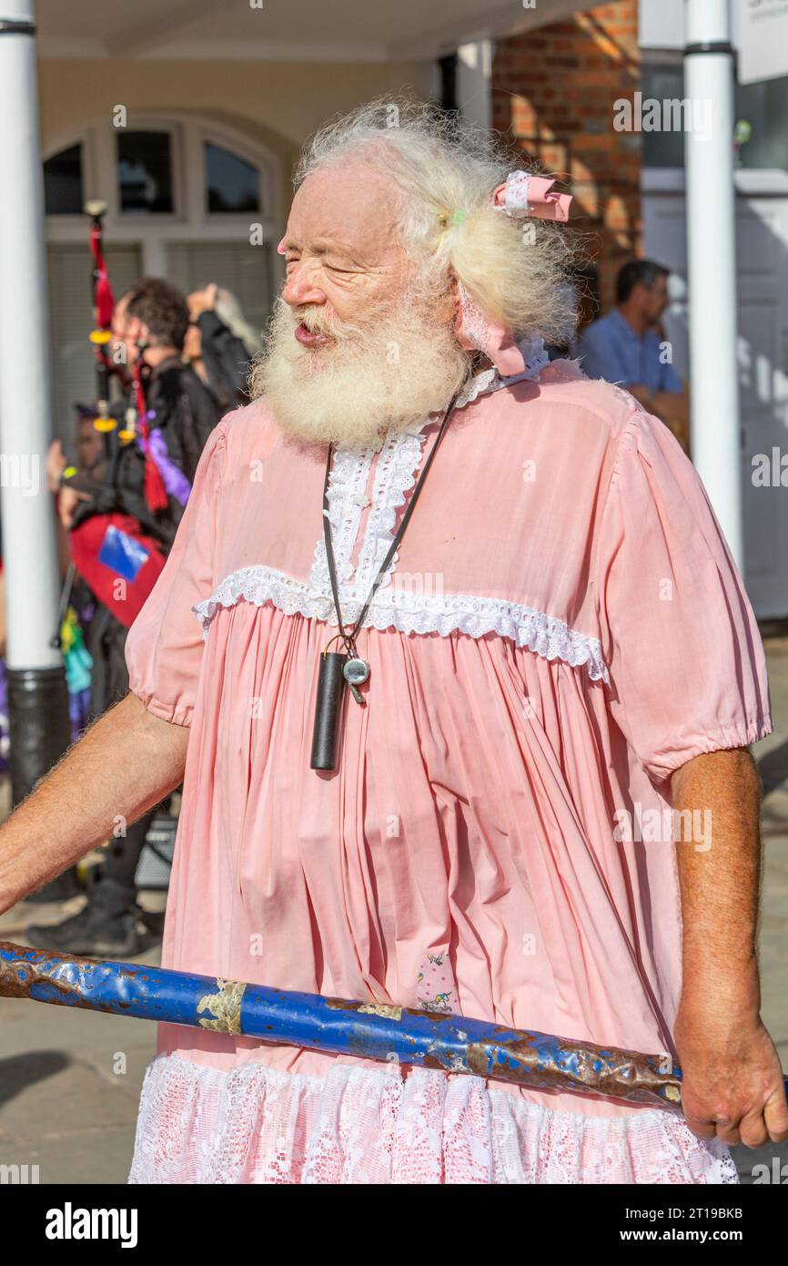 An Morris Dancer at the Tenterden Folk Festival wearing a pink smock ...