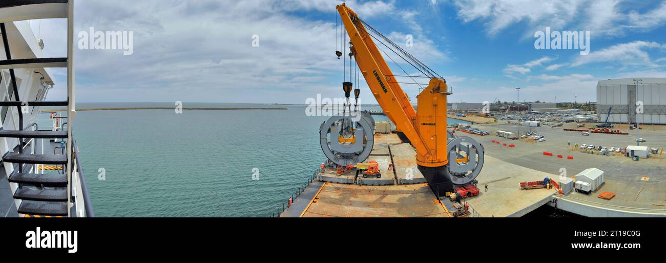 A newly constructed rail car dumper being loaded on to a shipping ferry ...