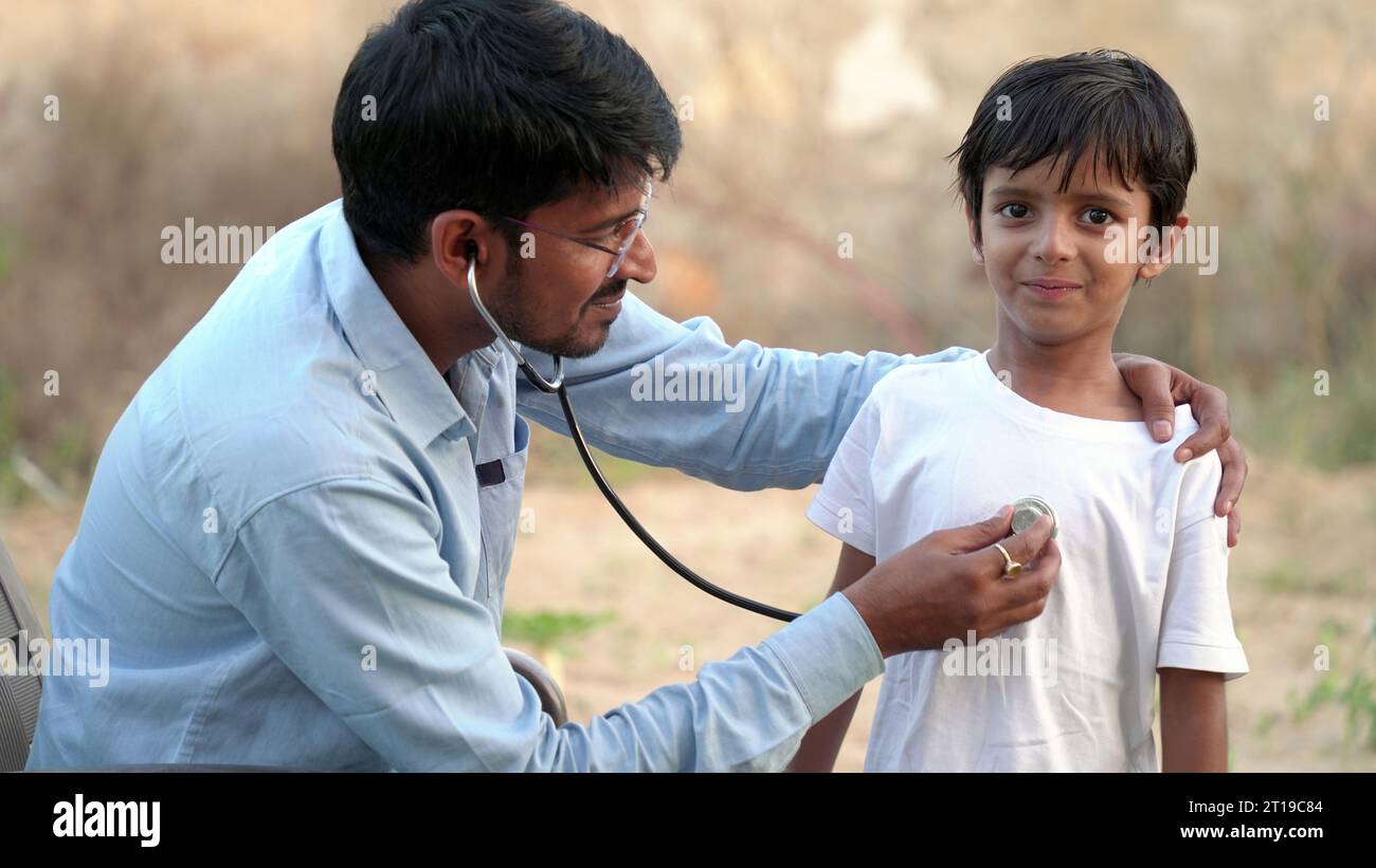 Indian young doctor of pediatrician holding stethoscope checking ...