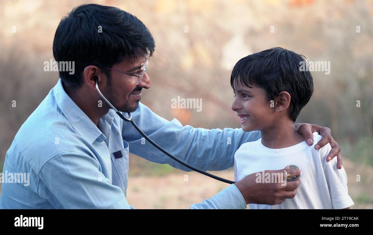 Indian young doctor of pediatrician holding stethoscope checking ...