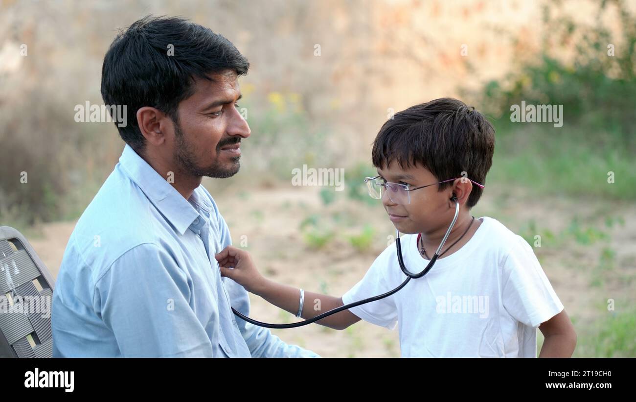 Indian kid doctor of pediatrician holding stethoscope checking ...