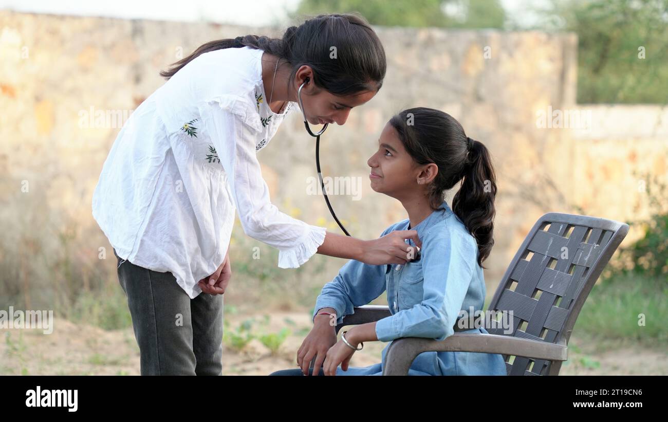 Female doctor or pediatrician with stethoscope listening to heartbeat ...