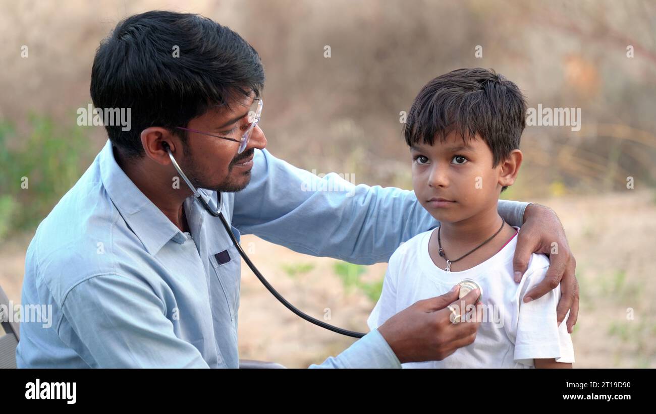 Indian young doctor of pediatrician holding stethoscope checking ...