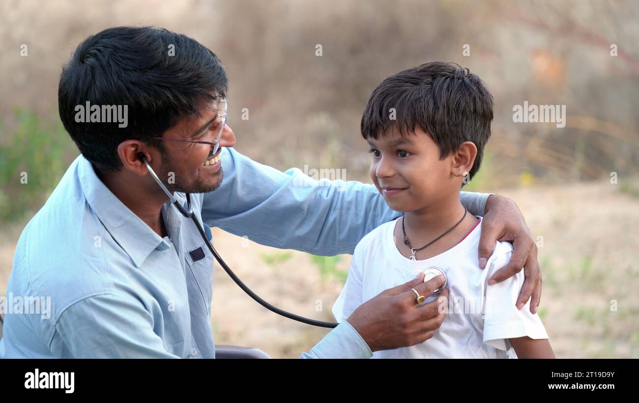 Indian young doctor of pediatrician holding stethoscope checking ...