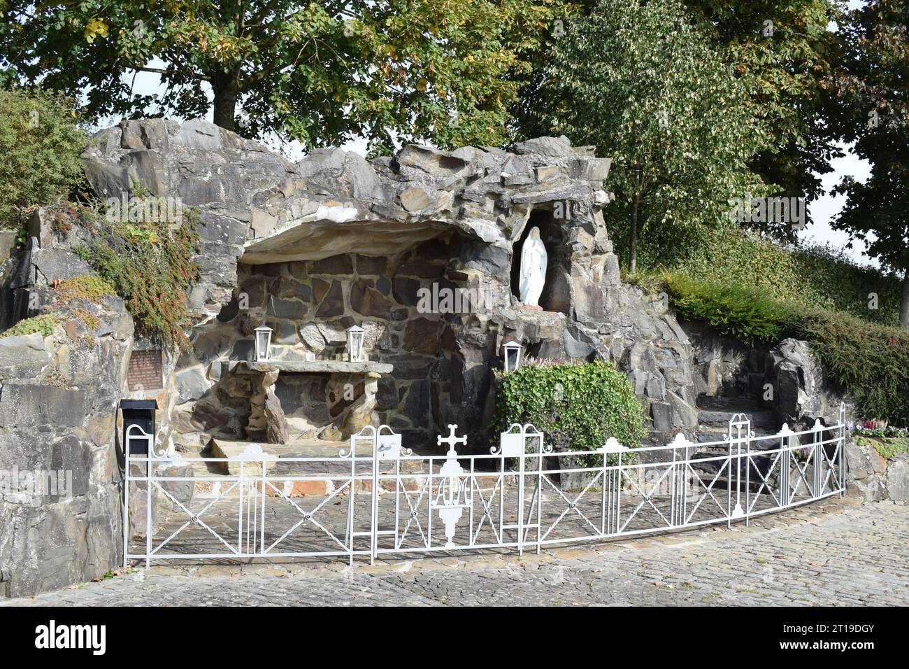 white Saint Mary statue in a cave Stock Photo - Alamy