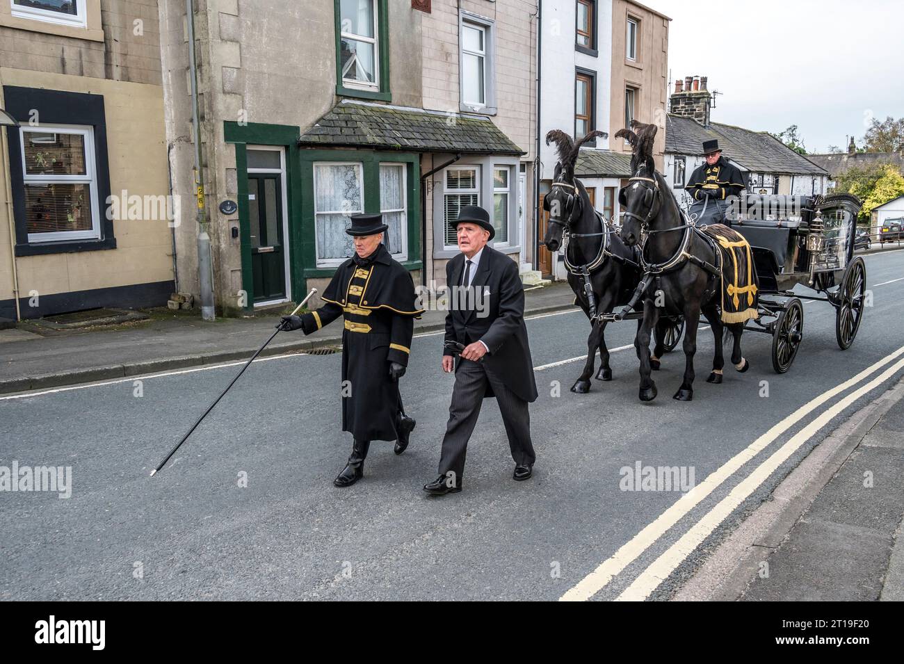 Funeral cortège with the funeral director leading a Victorian glass ...