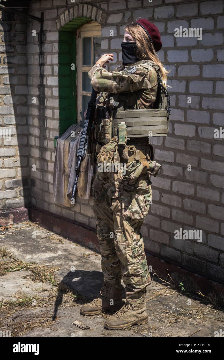 Donbas, Ukraine - July 17, 2023 Portrait of a Belarusian female soldier ...