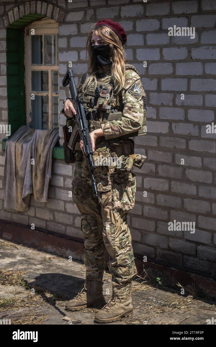 Donbas, Ukraine - July 17, 2023 Portrait of a Belarusian female soldier ...