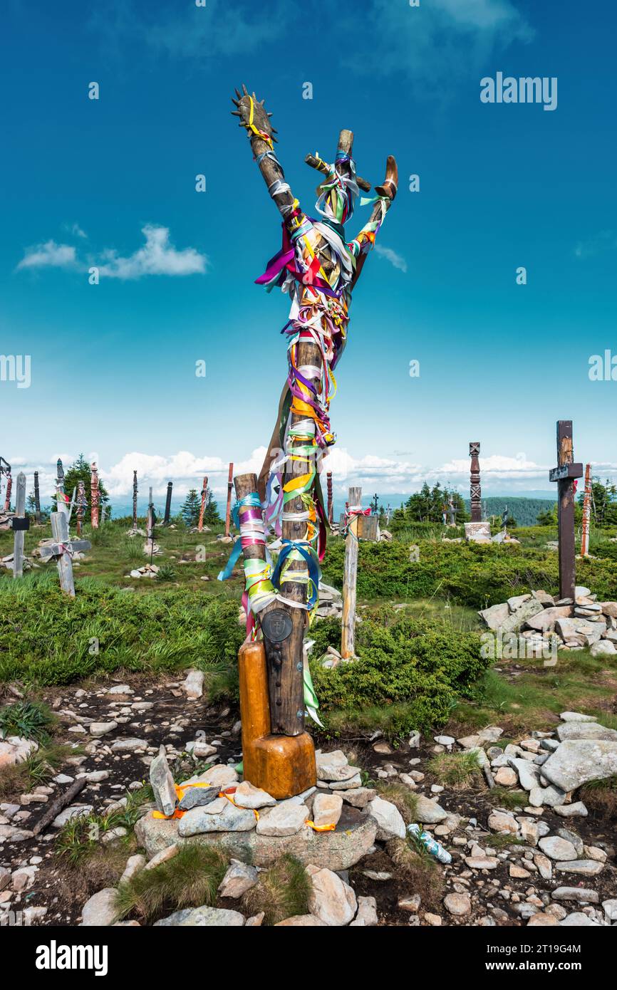 Shamanic sacred pole with colorful ribbons at Harghita Peak in the ...