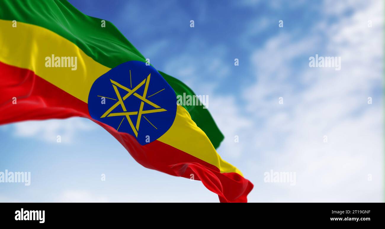 Ethiopia national flag waving on a clear day. Horizontal bands of green ...