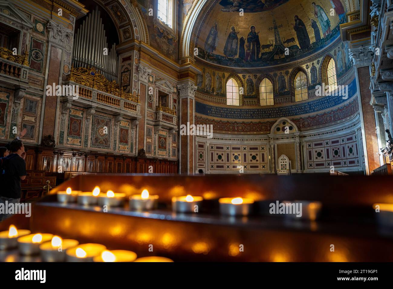 Prayer candles in the Lateran Basilica in Rome with background Stock ...