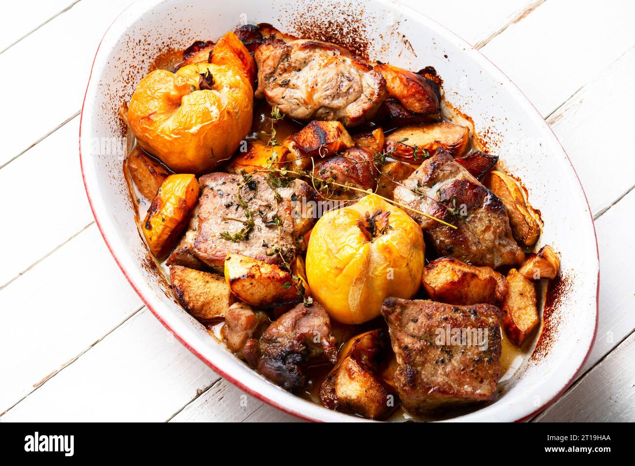 Delicious meat cooked with autumn fruits in tray Stock Photo - Alamy