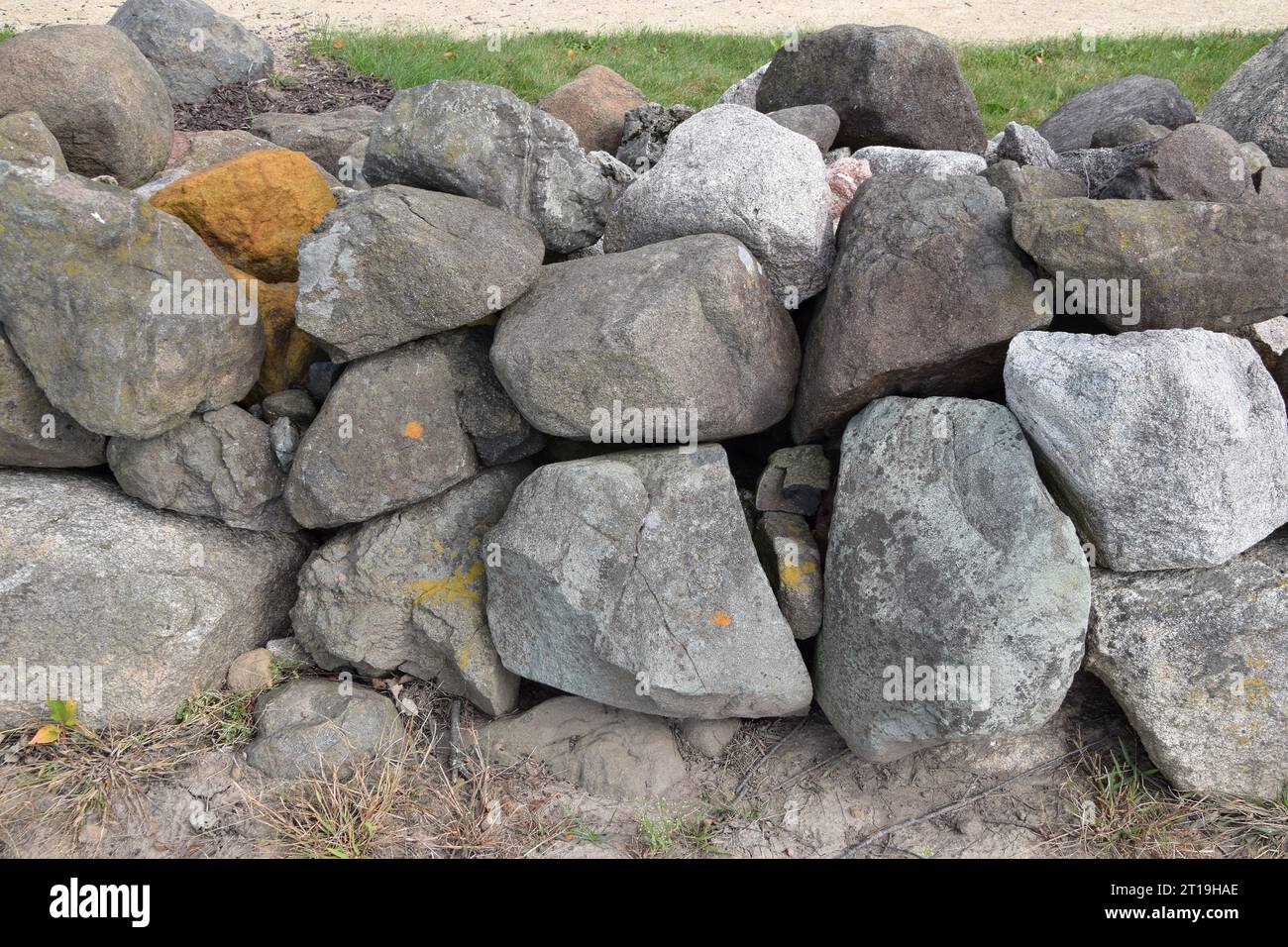 A pile of rocks as part of a rock/stone wall or fence Stock Photo - Alamy