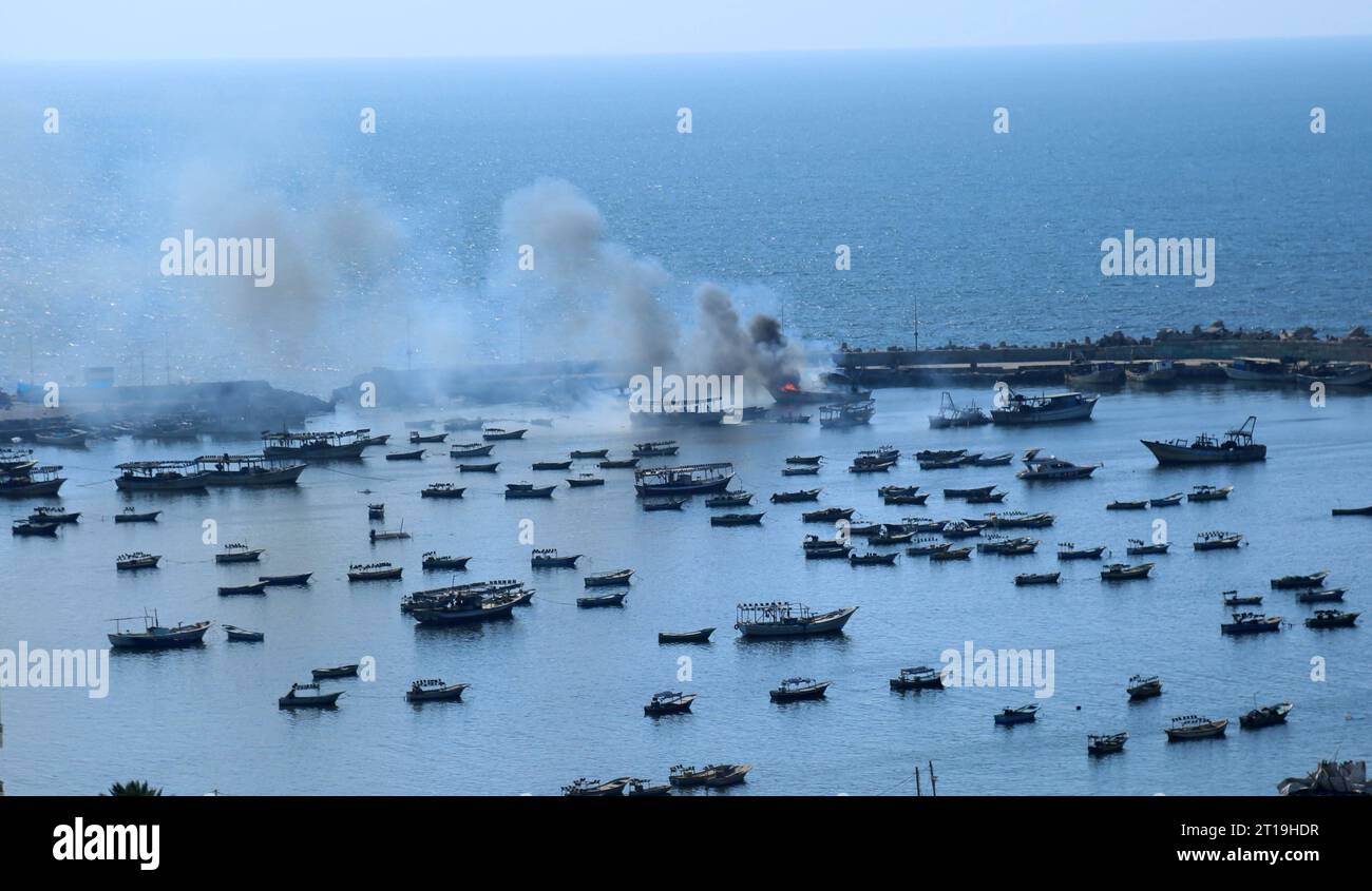 Smoke billows from a boat after a strike by Israel on the port of Gaza ...