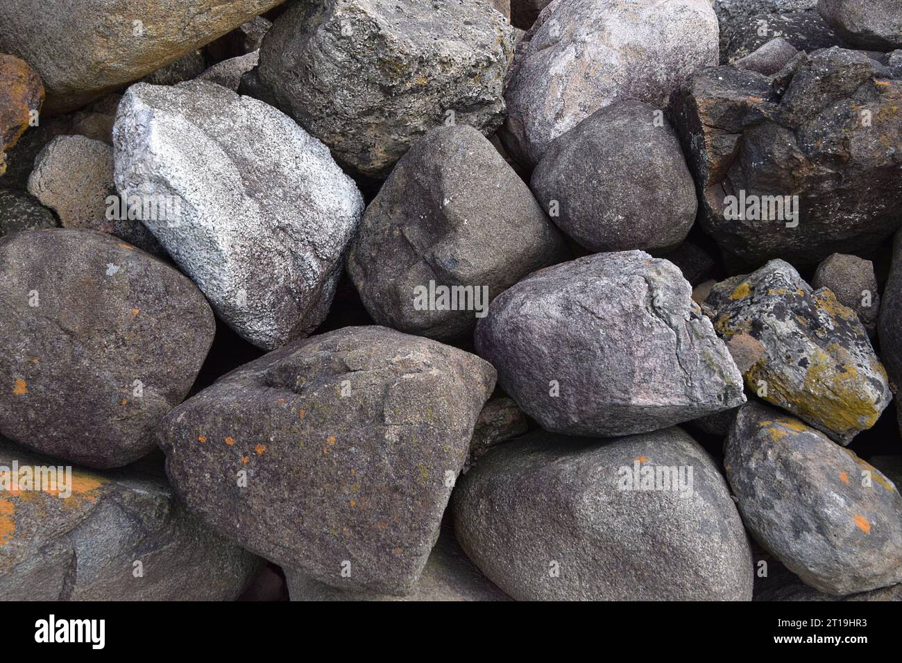 A pile of rocks as part of a rock/stone wall or fence Stock Photo - Alamy