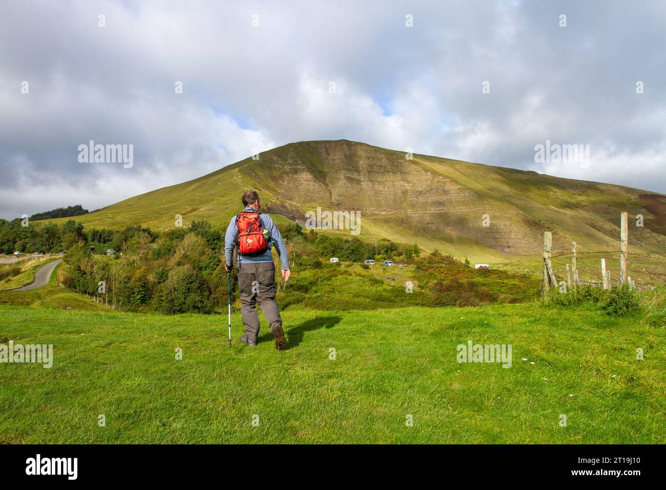 Man backpacking hill walking in the English Peak District above the ...