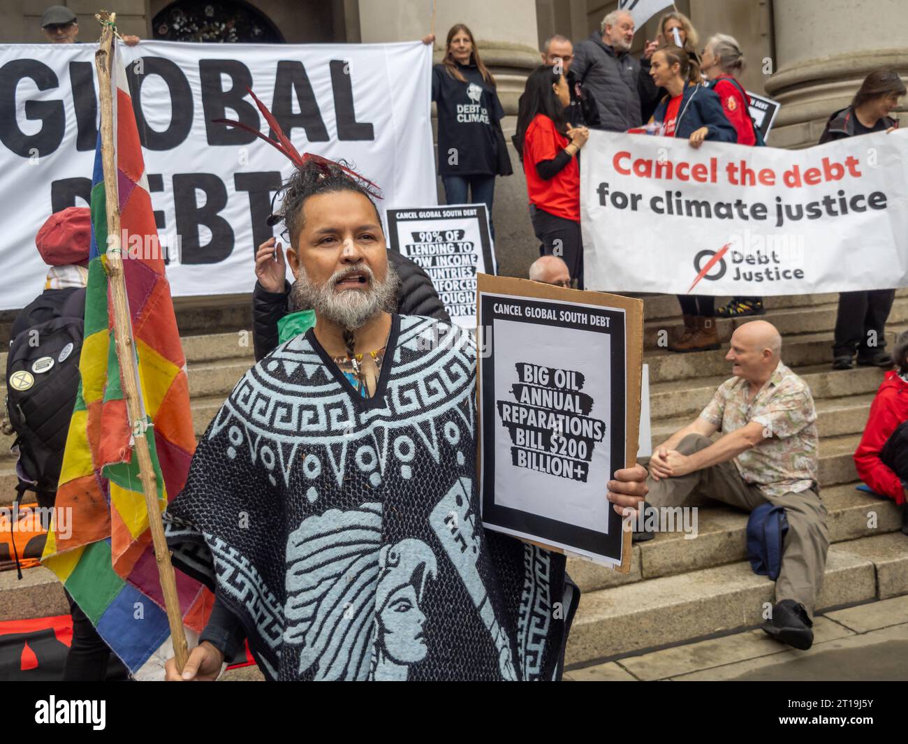 London, UK. 12 Oct 2023. An indigenous protester calls for reparations ...