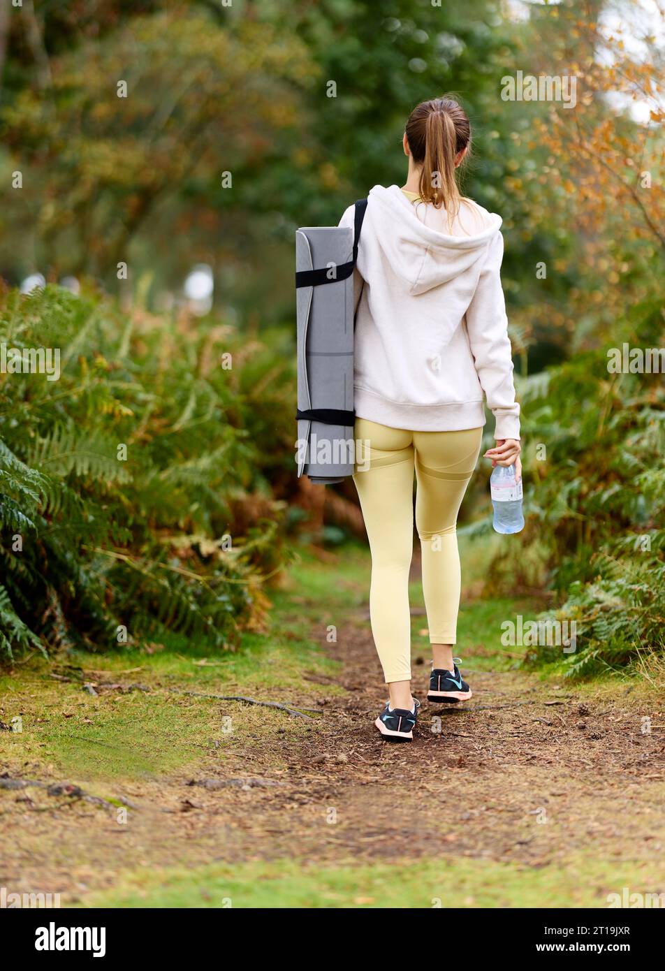 Woman walking outdoors Stock Photo - Alamy