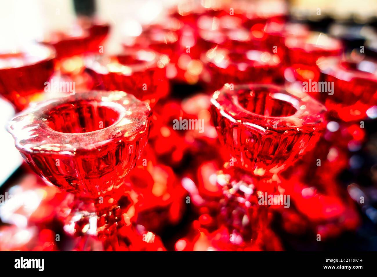a set of transparent and shining red glass bottles, close up image from ...