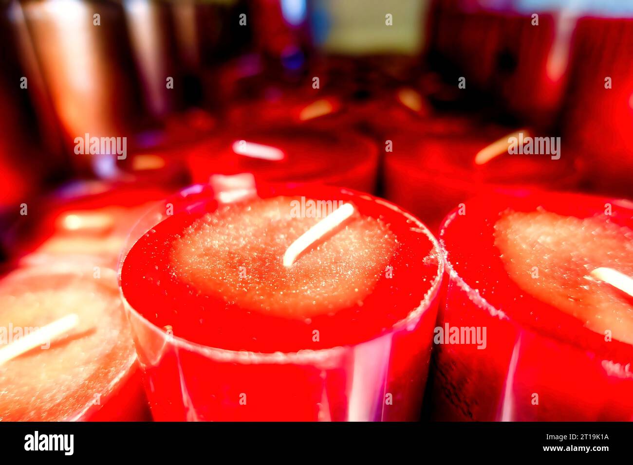 set of red candles with white wick in a row, close-up, top view. A ...