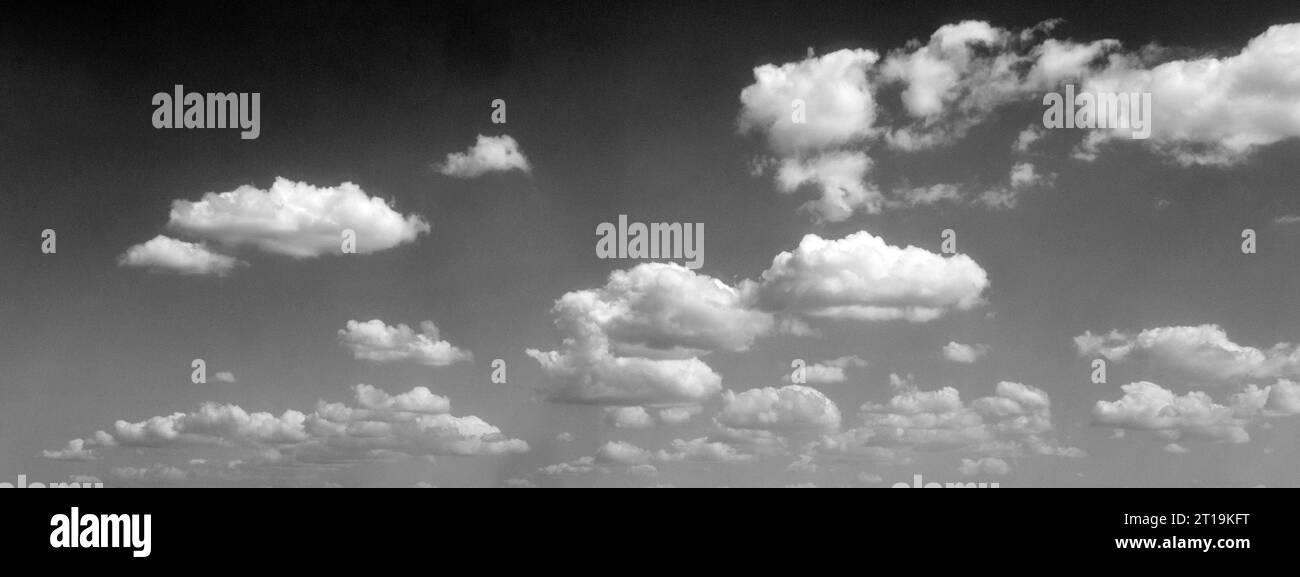 Black and White Beautiful sky with fluffy white clouds over modern city background, cloudscape ...