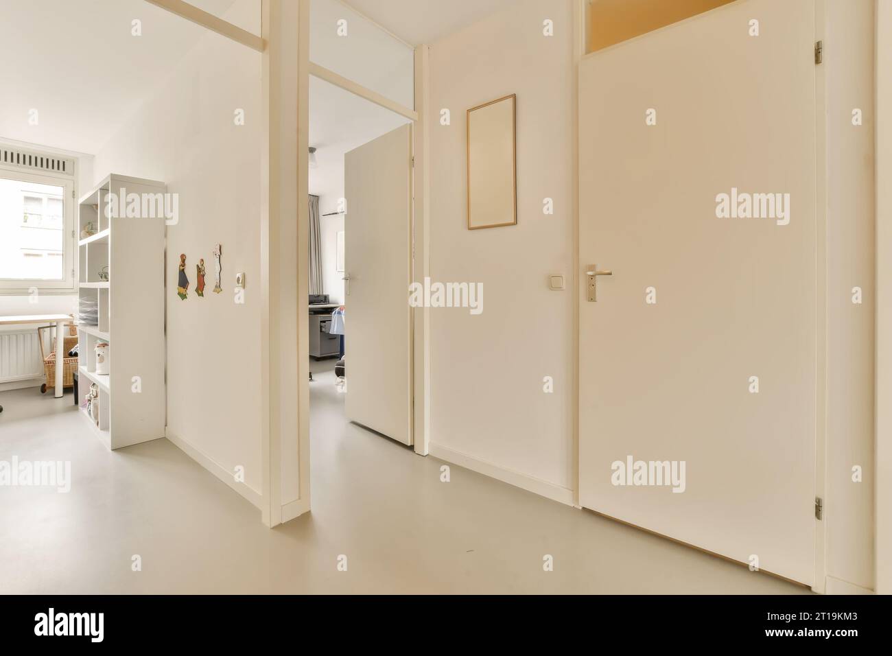 an empty room with white walls and door handles on the doors are closed ...