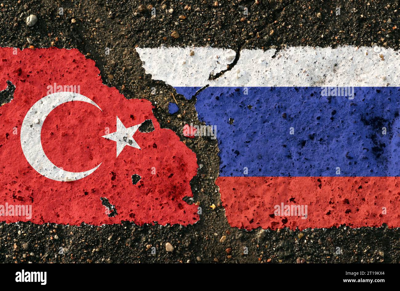 On the pavement are images of the flags of Turkey and Russia, as a ...