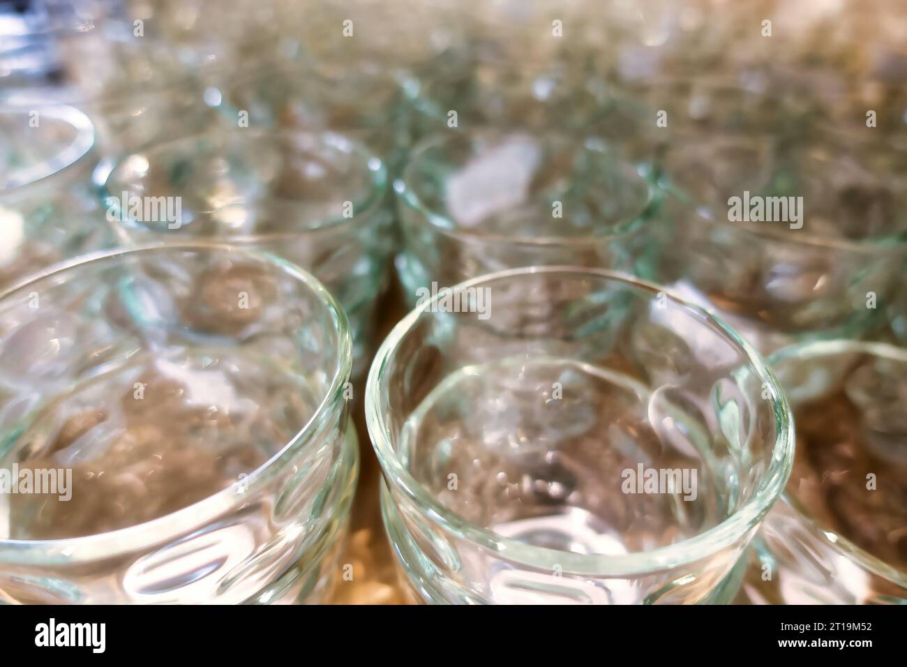 a set of transparent and shining glass bottles, close up image from the ...