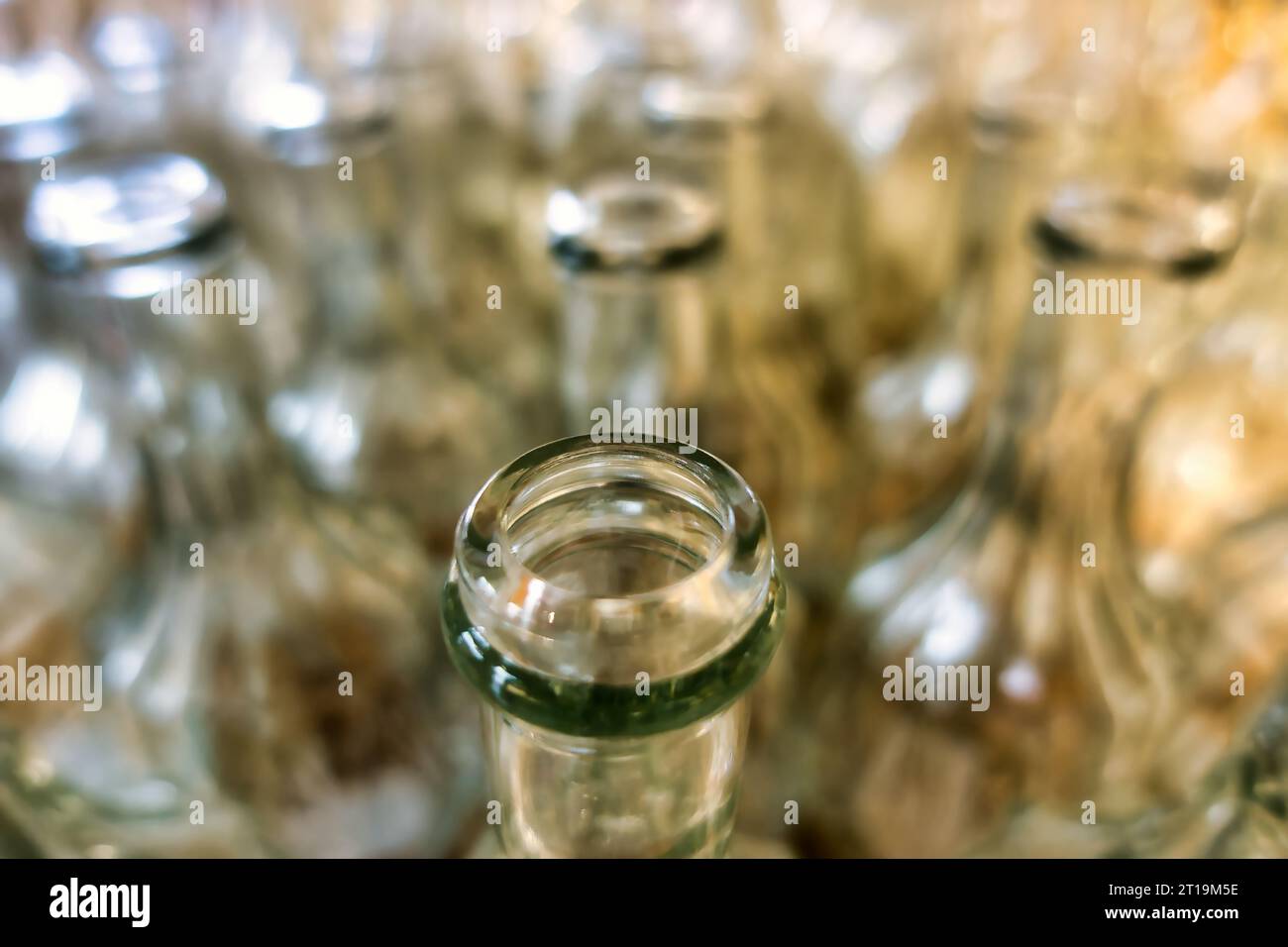 a set of transparent and shining glass bottles, close up image from the ...