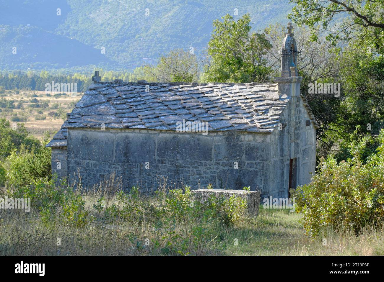 small stone church built with large tombstones called 'stecci' in ...