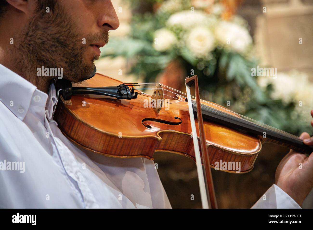 Person playing violin. Caucasian violinist man wearing classical ...