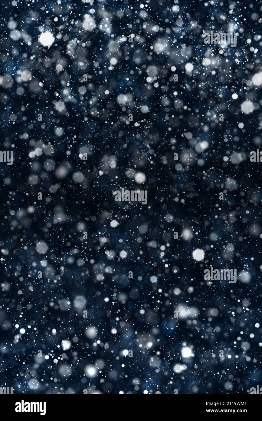 Snow falling from night sky. Winter background Stock Photo - Alamy